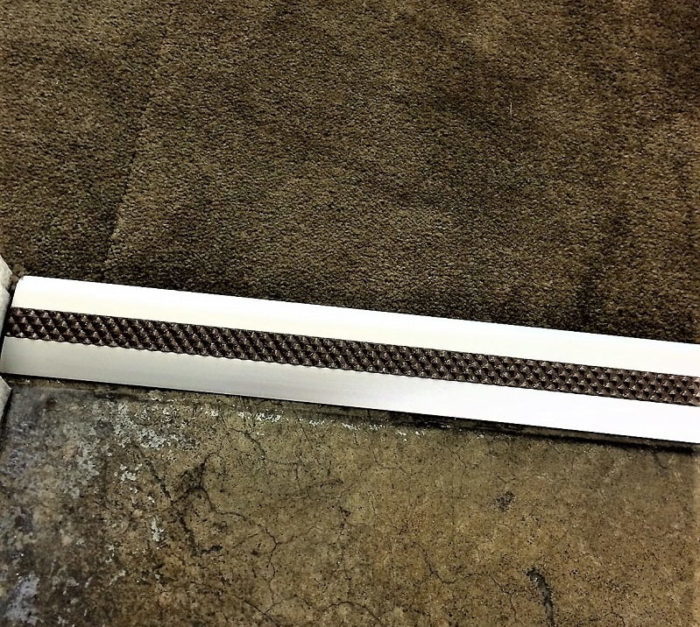 Transition bars remove trip hazards on outdoor matting